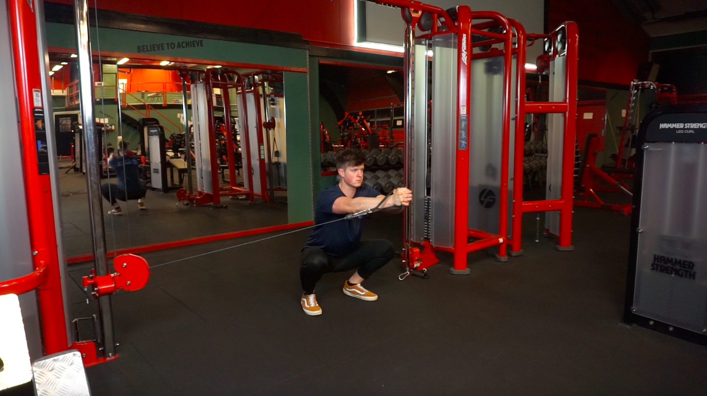 Static Wood Chop Squat - FitnessBasen